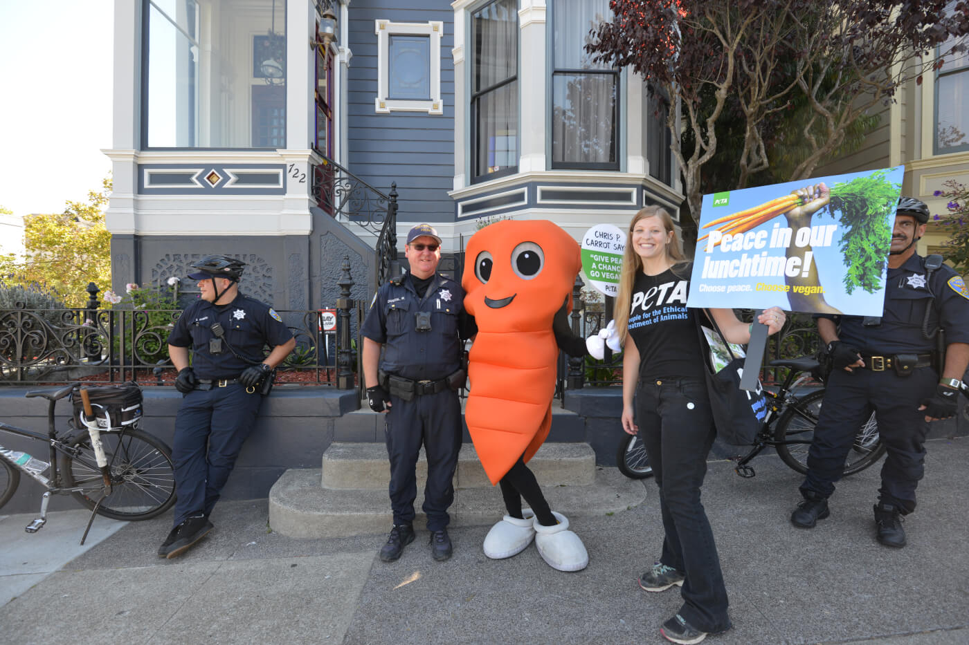 PETA's Dancing Veggies Jolly Up Rally With 'Give Peas a Chance!' Signs